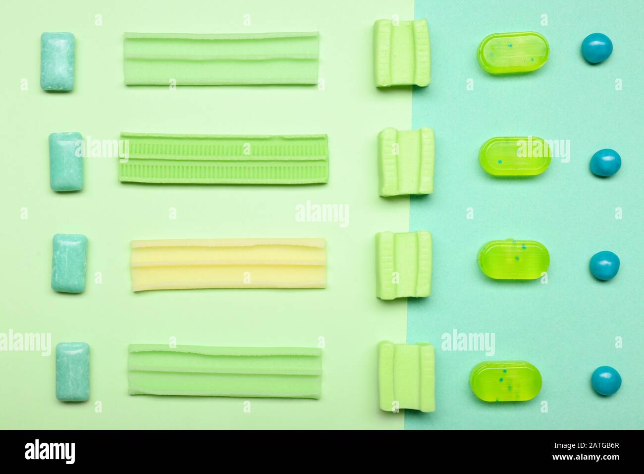 Different chewing gums on color background Stock Photo - Alamy