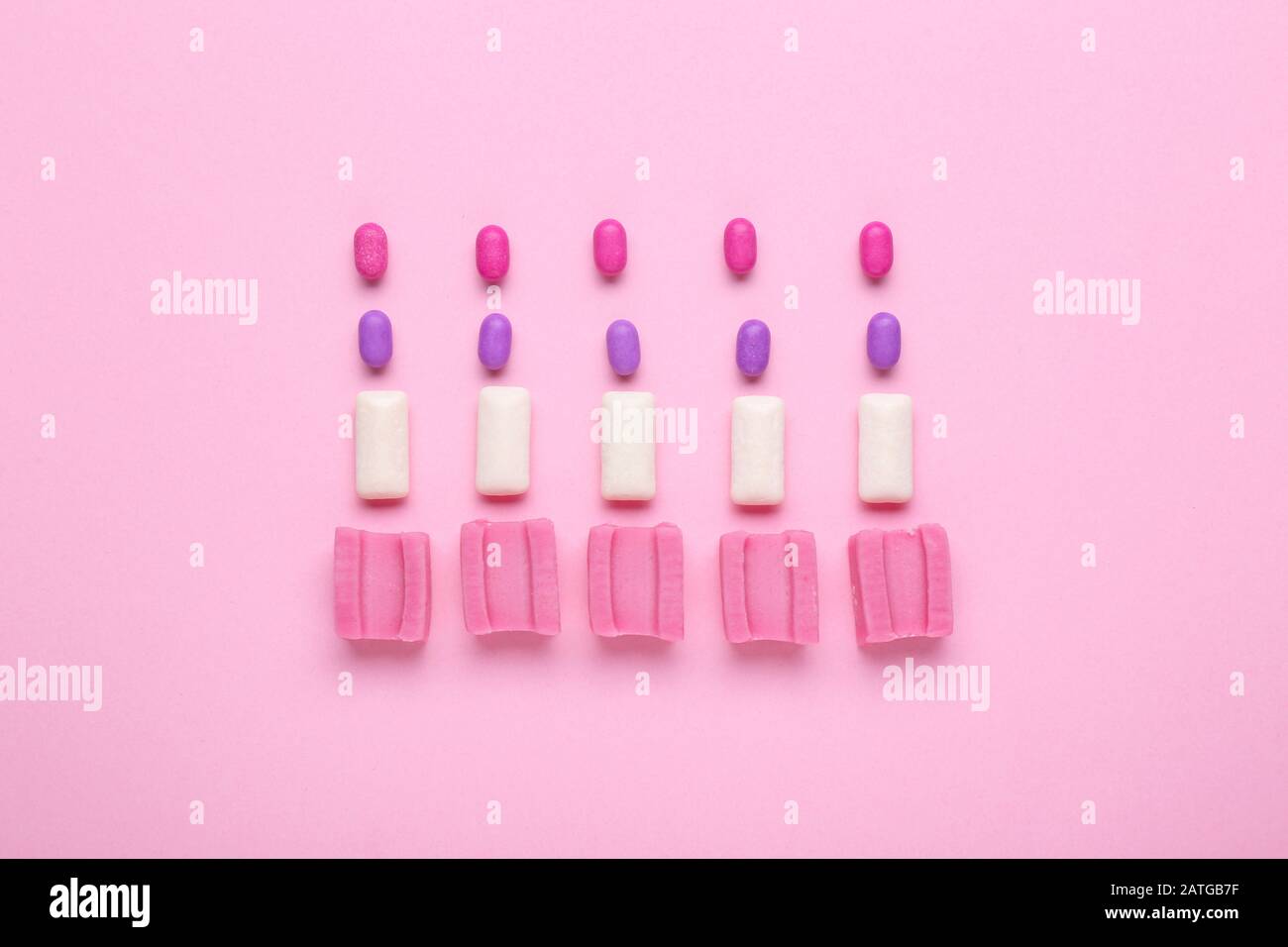 Different chewing gums on color background Stock Photo - Alamy