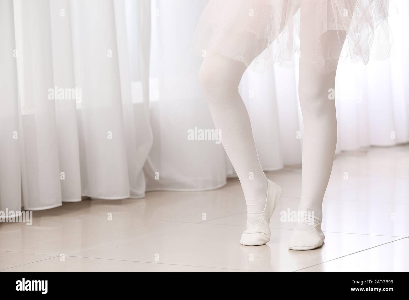 Legs of little ballerina in dance studio Stock Photo - Alamy