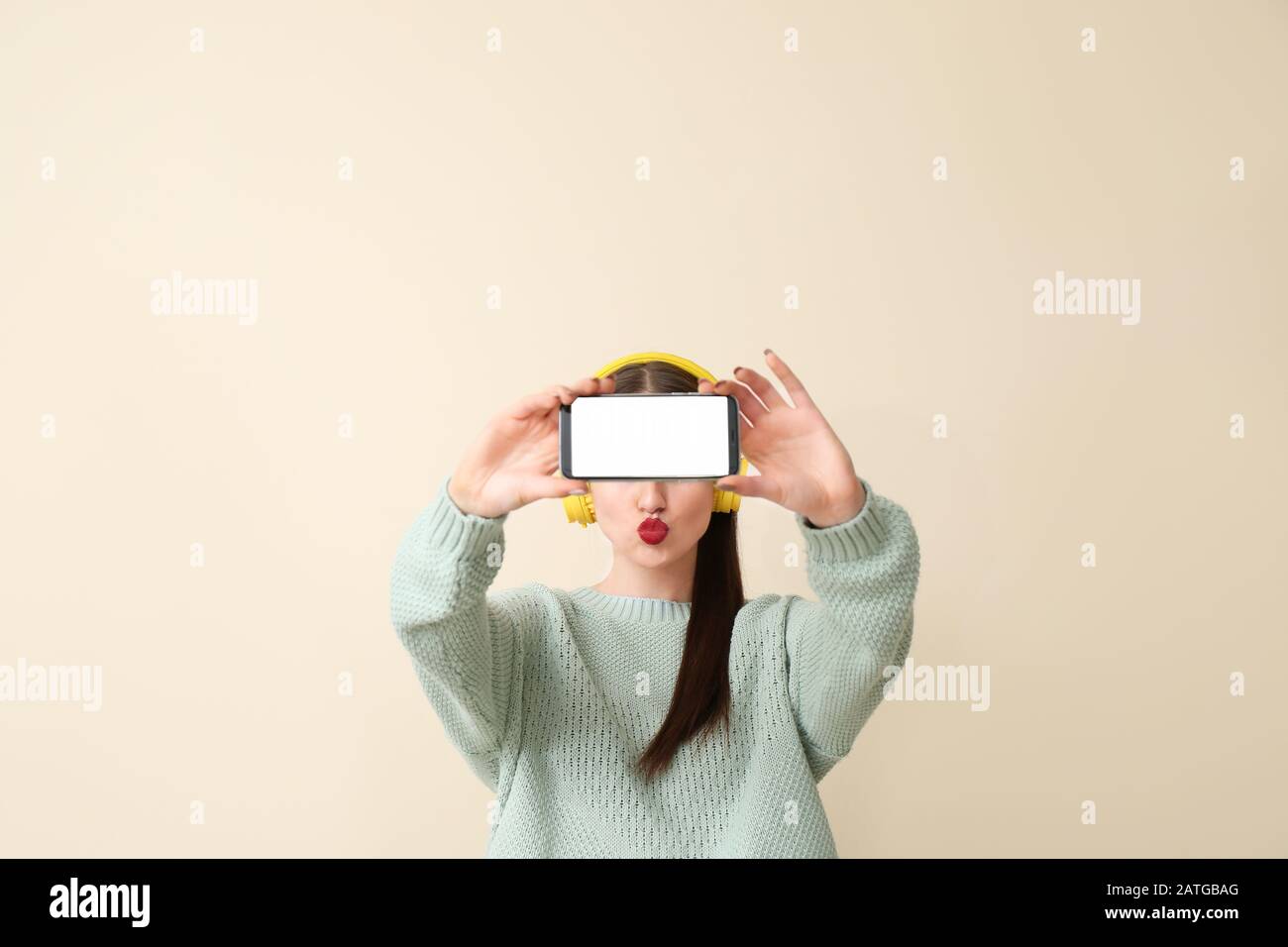 Beautiful young woman taking selfie on color background Stock Photo - Alamy
