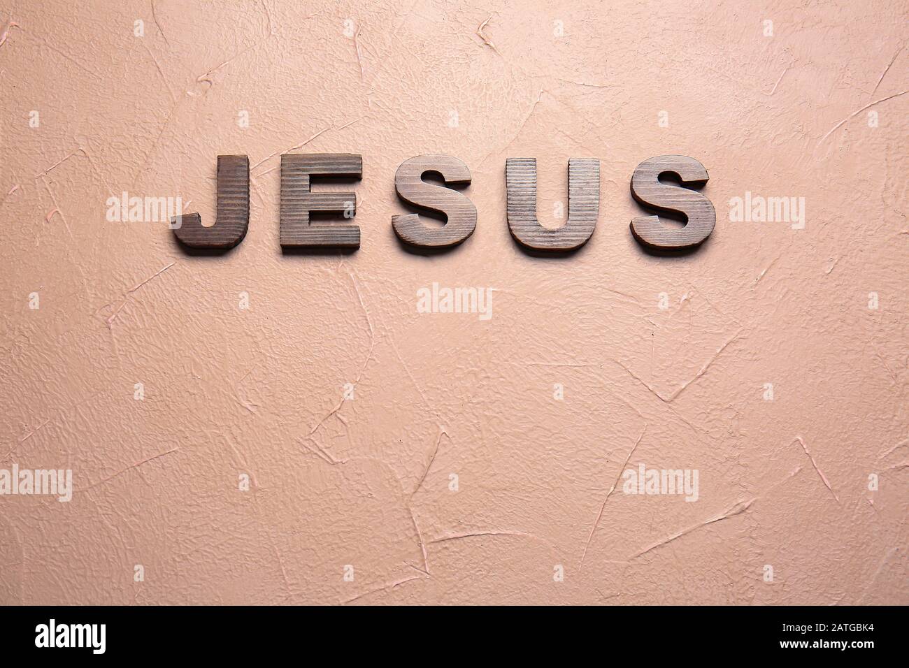 Text JESUS on color background Stock Photo - Alamy