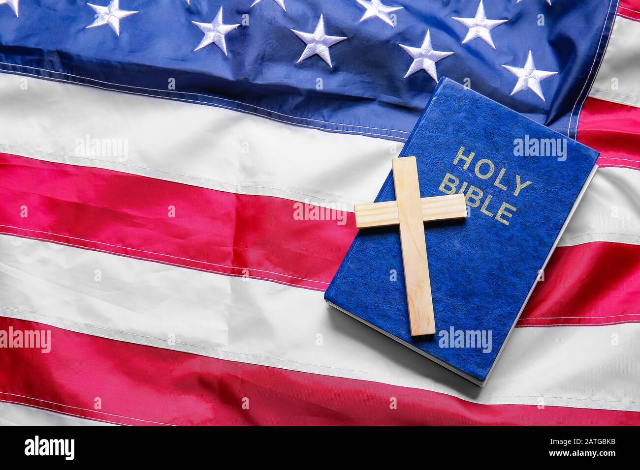 Christian cross and Bible on USA flag Stock Photo - Alamy