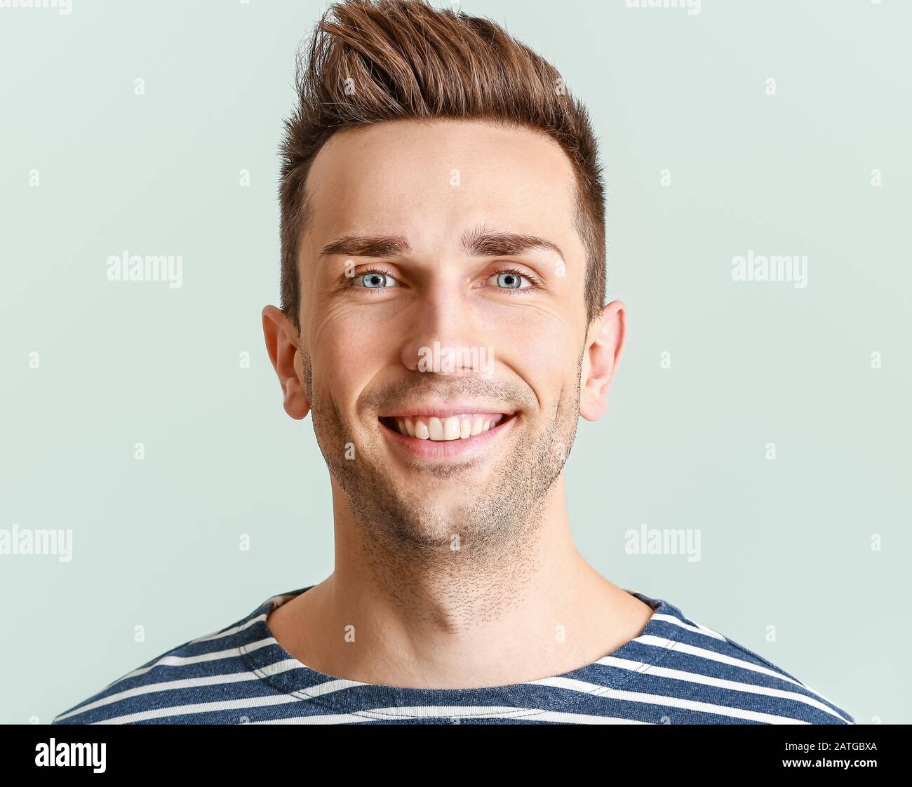 Handsome young man with healthy teeth on white background Stock Photo ...
