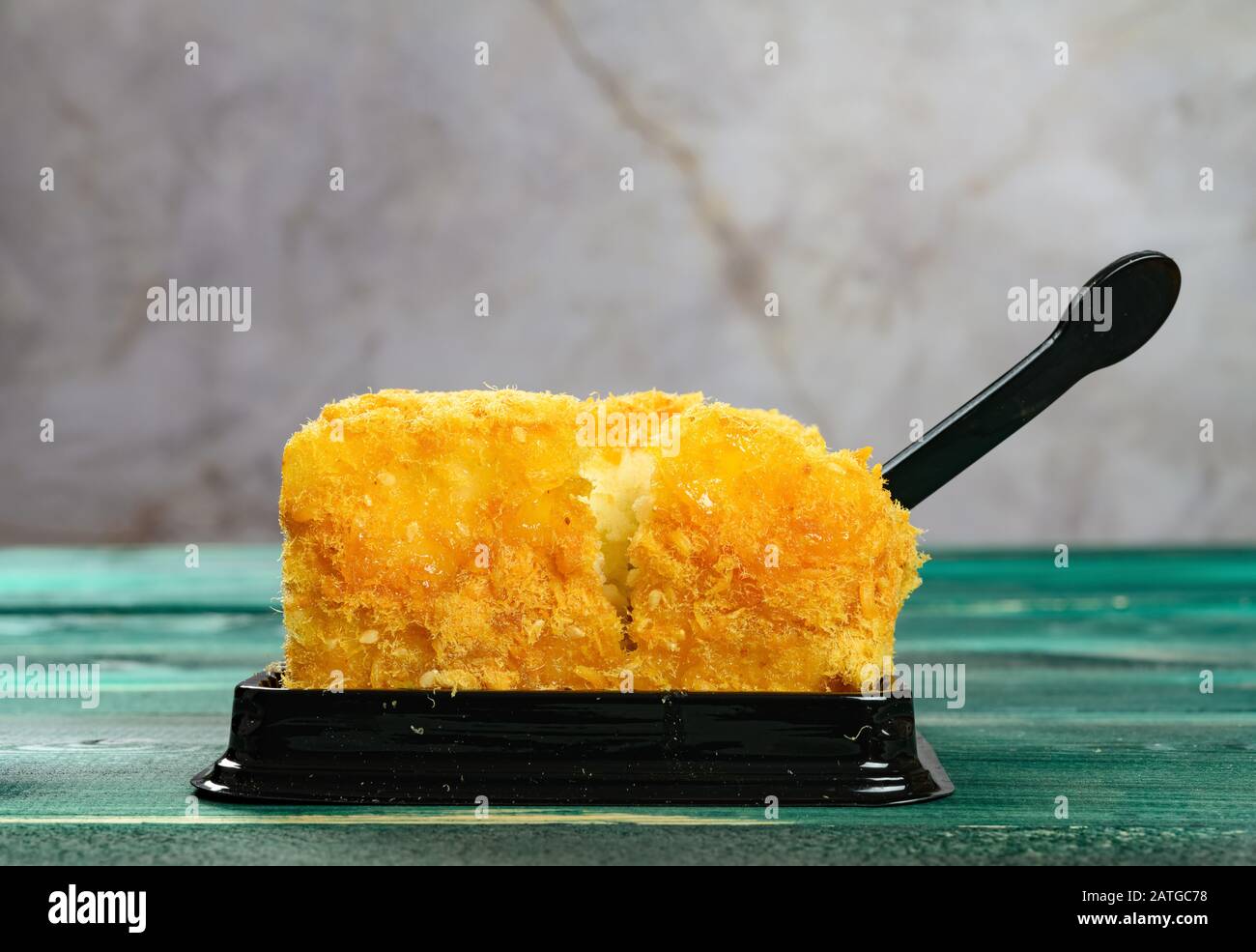 eating shredded pork cake with spoon Stock Photo - Alamy