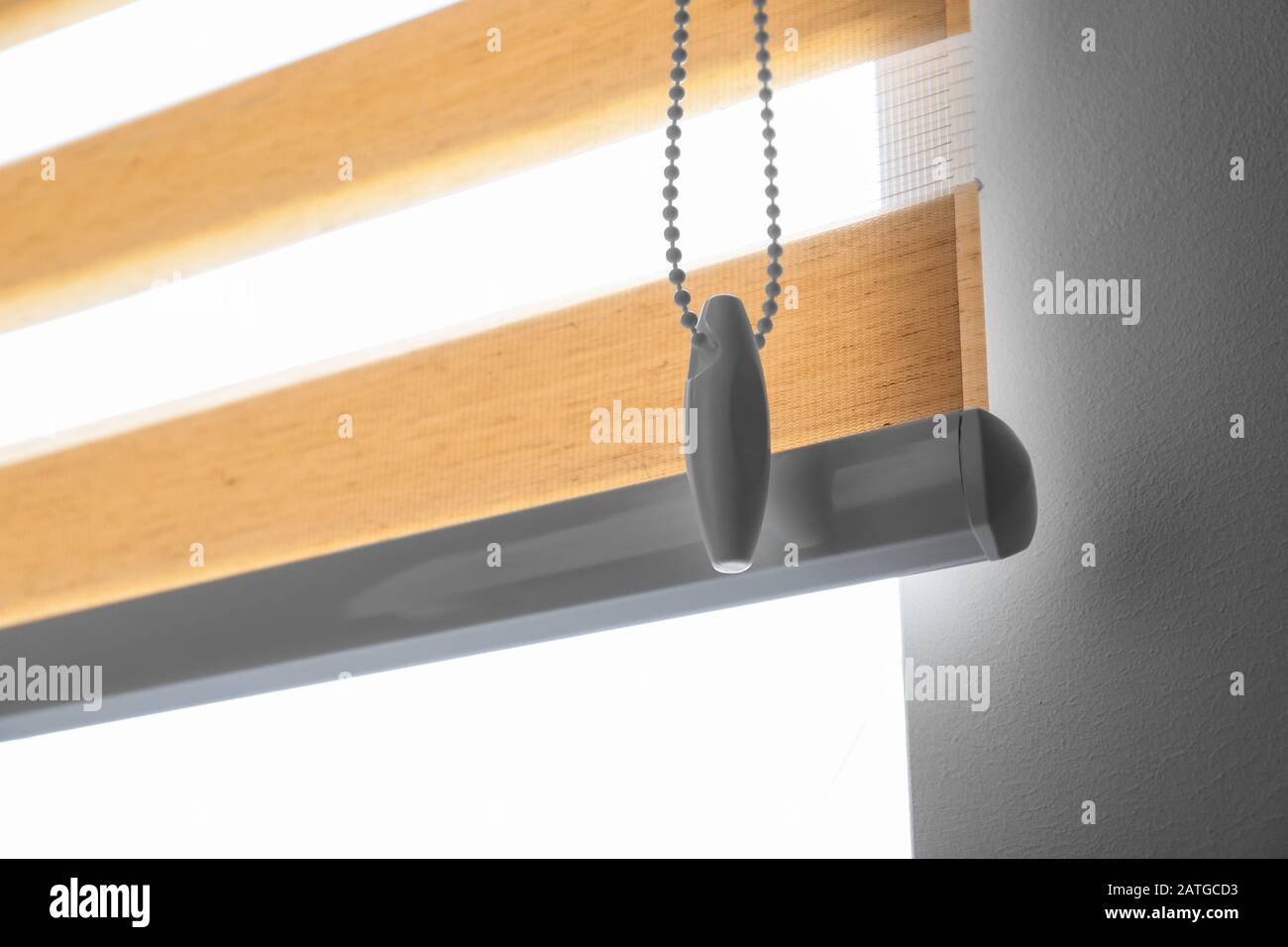 Modern blinds hanging on window, closeup Stock Photo - Alamy