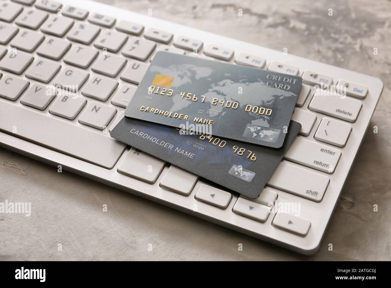 Credit cards with computer keyboard on grunge background. Concept of ...