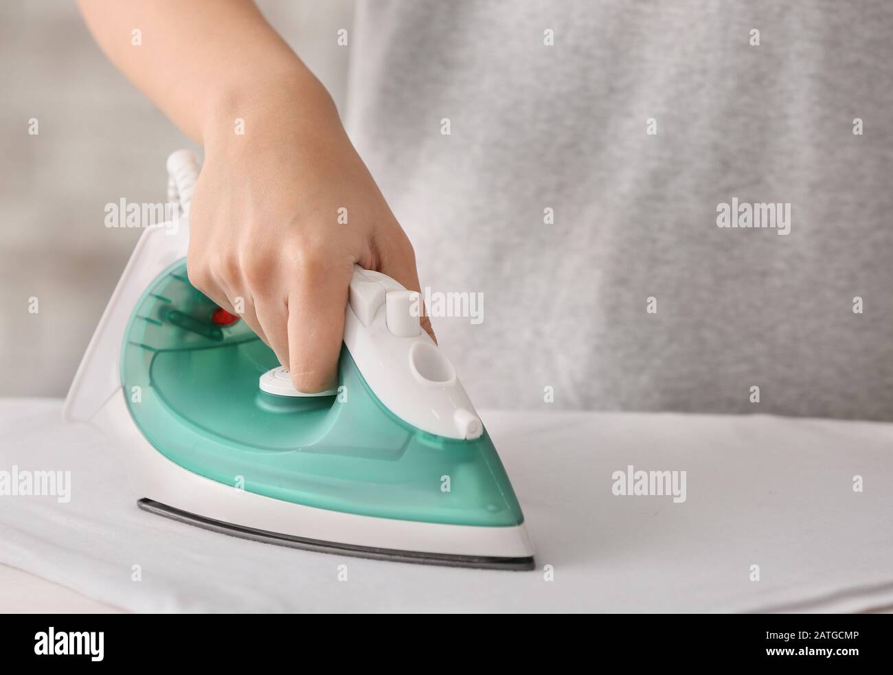 Woman ironing clothes at home, closeup Stock Photo - Alamy