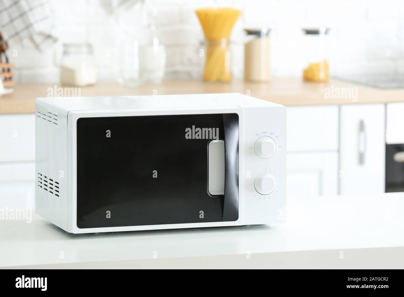 Modern microwave oven in kitchen Stock Photo - Alamy