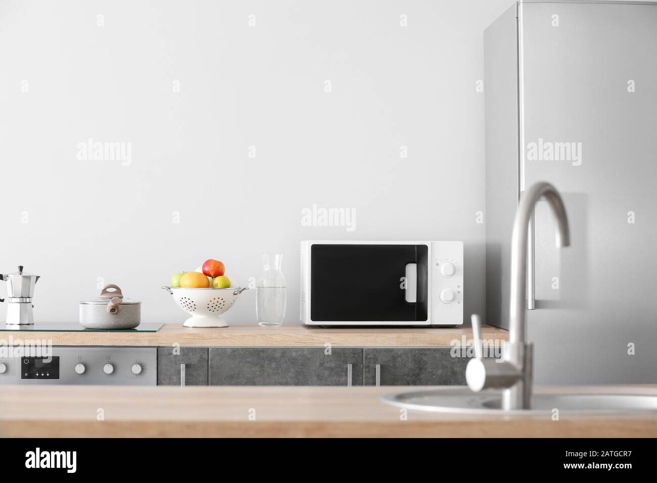 Interior of kitchen with modern microwave oven Stock Photo - Alamy