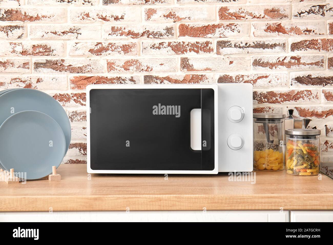 Modern microwave oven in kitchen Stock Photo - Alamy