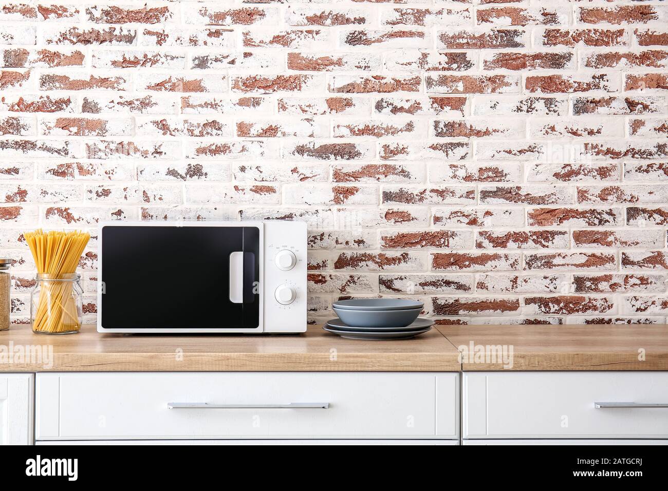 Modern microwave oven in kitchen Stock Photo - Alamy