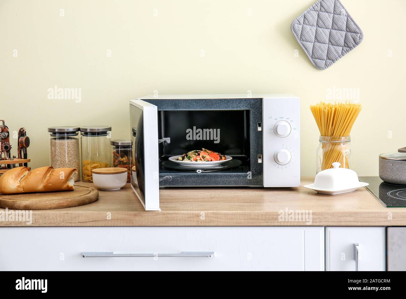 Modern microwave oven in kitchen Stock Photo - Alamy