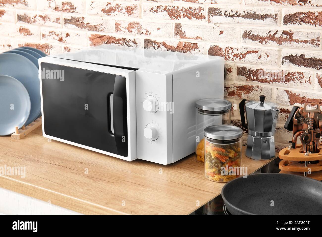 Modern microwave oven in kitchen Stock Photo - Alamy