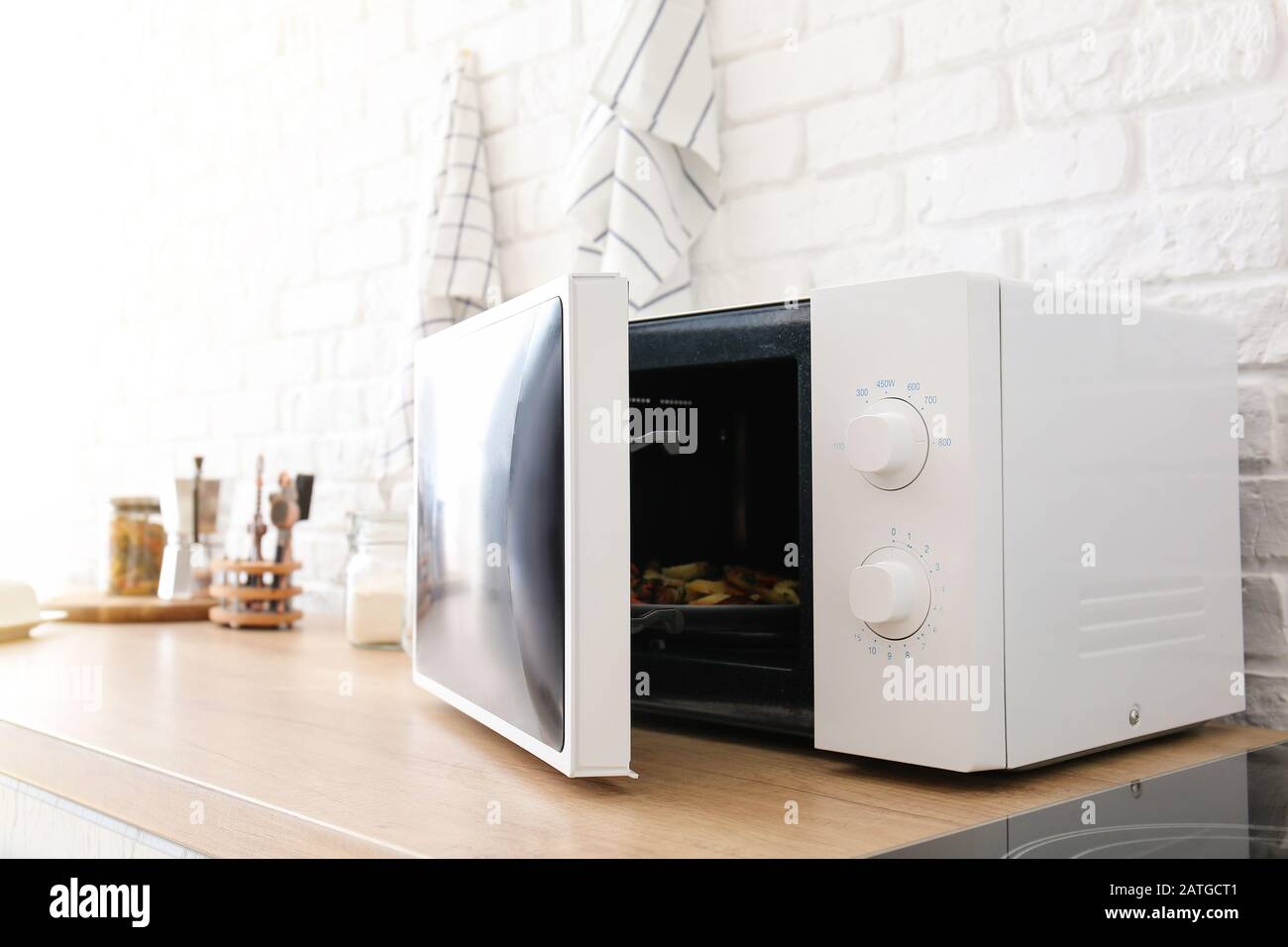 Modern microwave oven in kitchen Stock Photo - Alamy