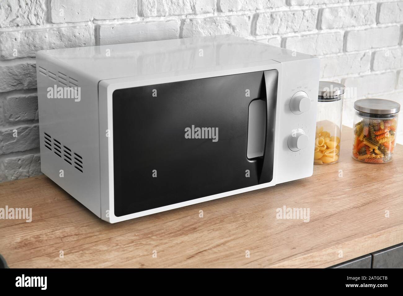 Modern microwave oven in kitchen Stock Photo - Alamy