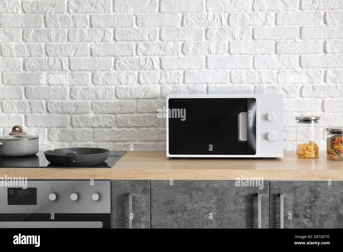 Modern microwave oven in kitchen Stock Photo - Alamy