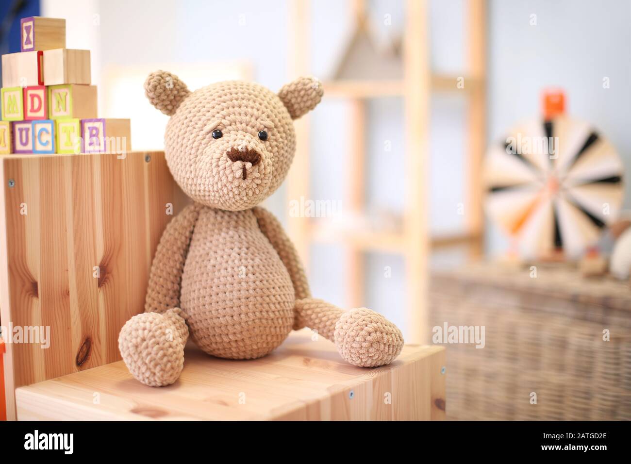 Cute baby toy on chair Stock Photo - Alamy
