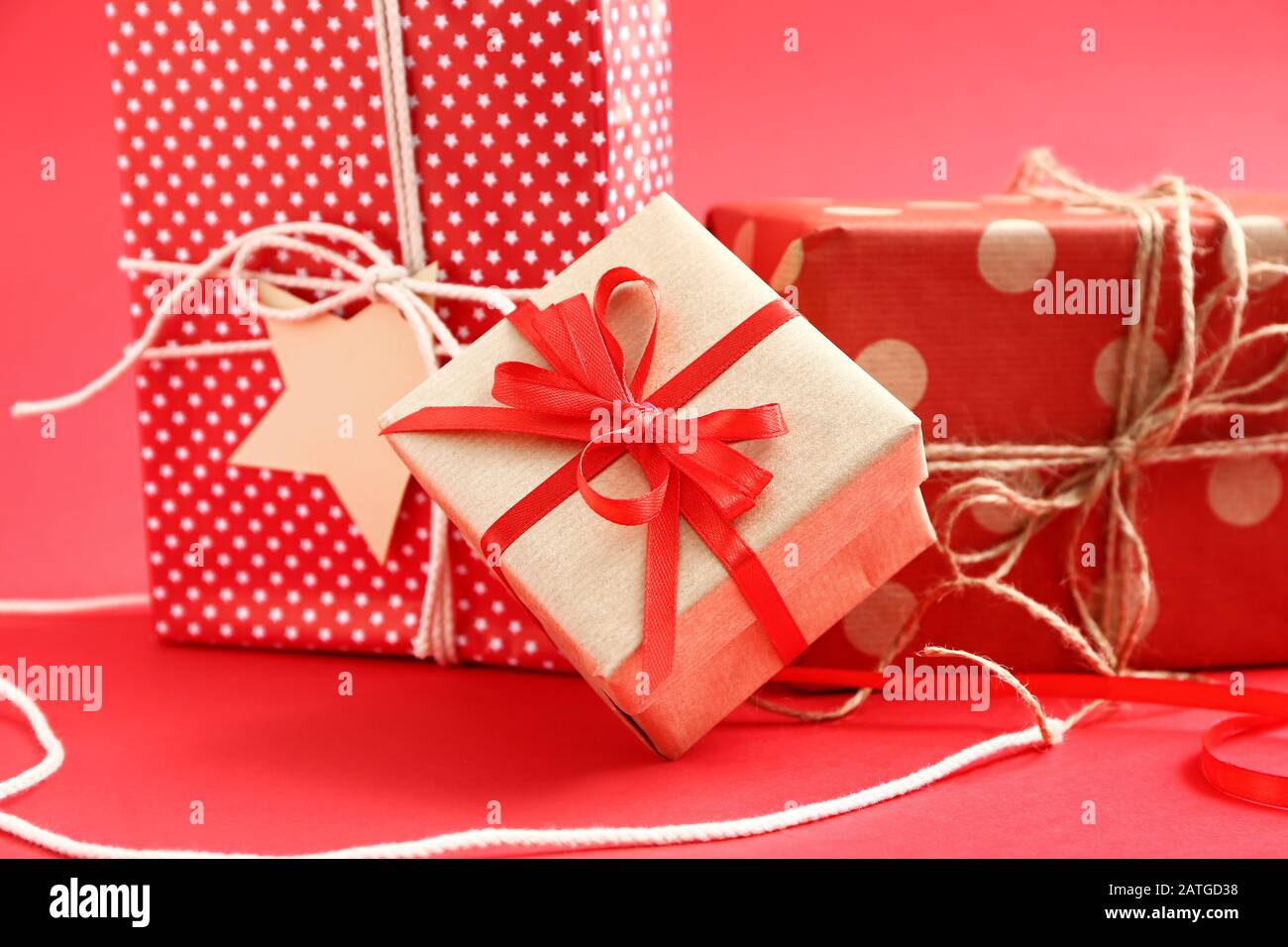 Packed gifts on color background Stock Photo - Alamy