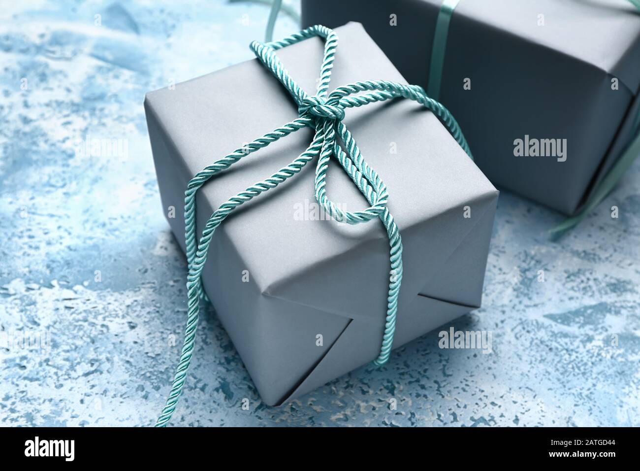 Packed gifts on color background Stock Photo - Alamy