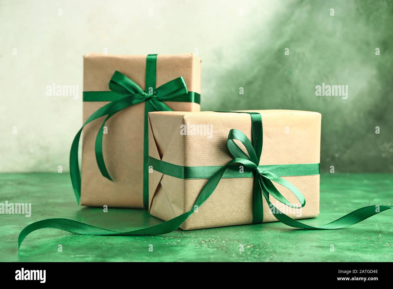 Packed gifts on color background Stock Photo - Alamy