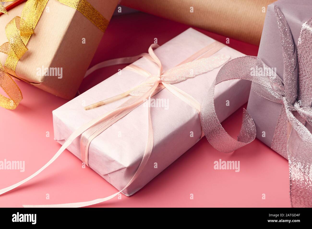 Packed gifts on color background Stock Photo - Alamy
