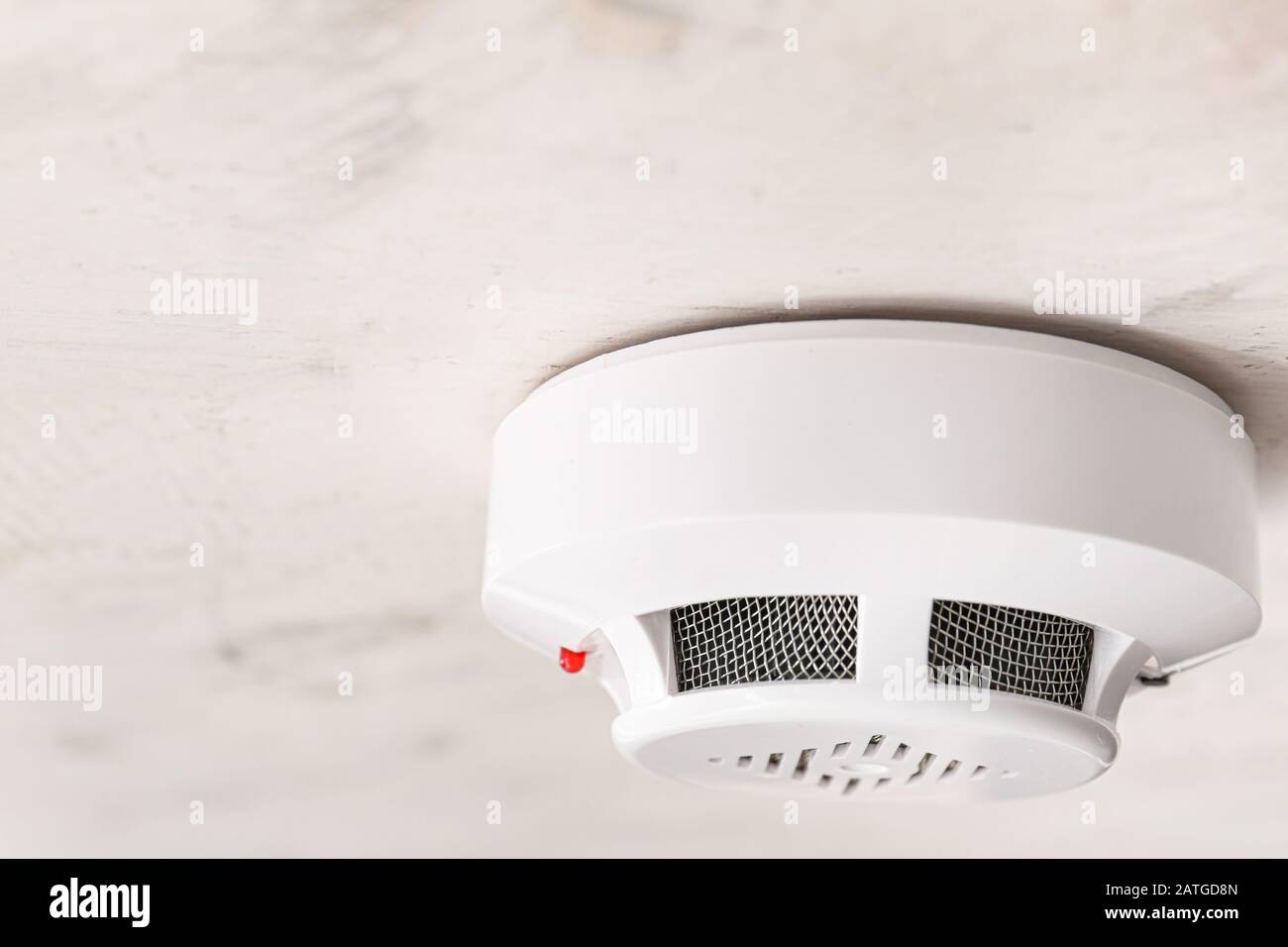Modern smoke detector on ceiling Stock Photo - Alamy
