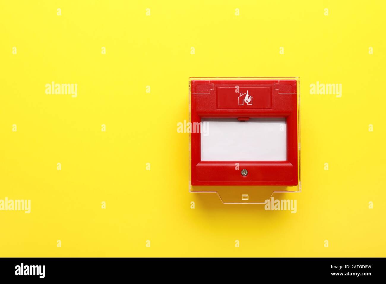 Modern manual call point on color background Stock Photo - Alamy