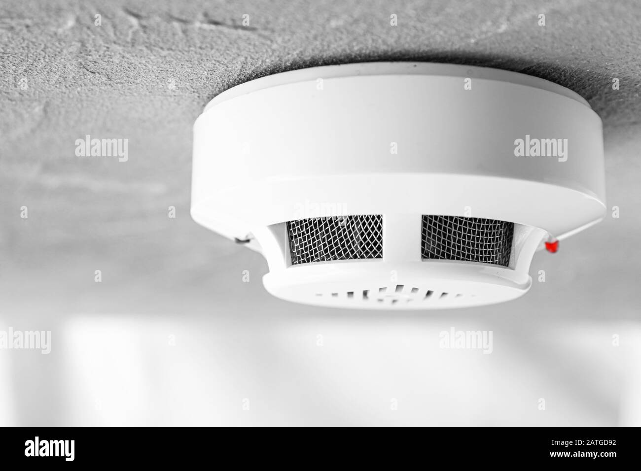 Modern smoke detector on ceiling Stock Photo - Alamy