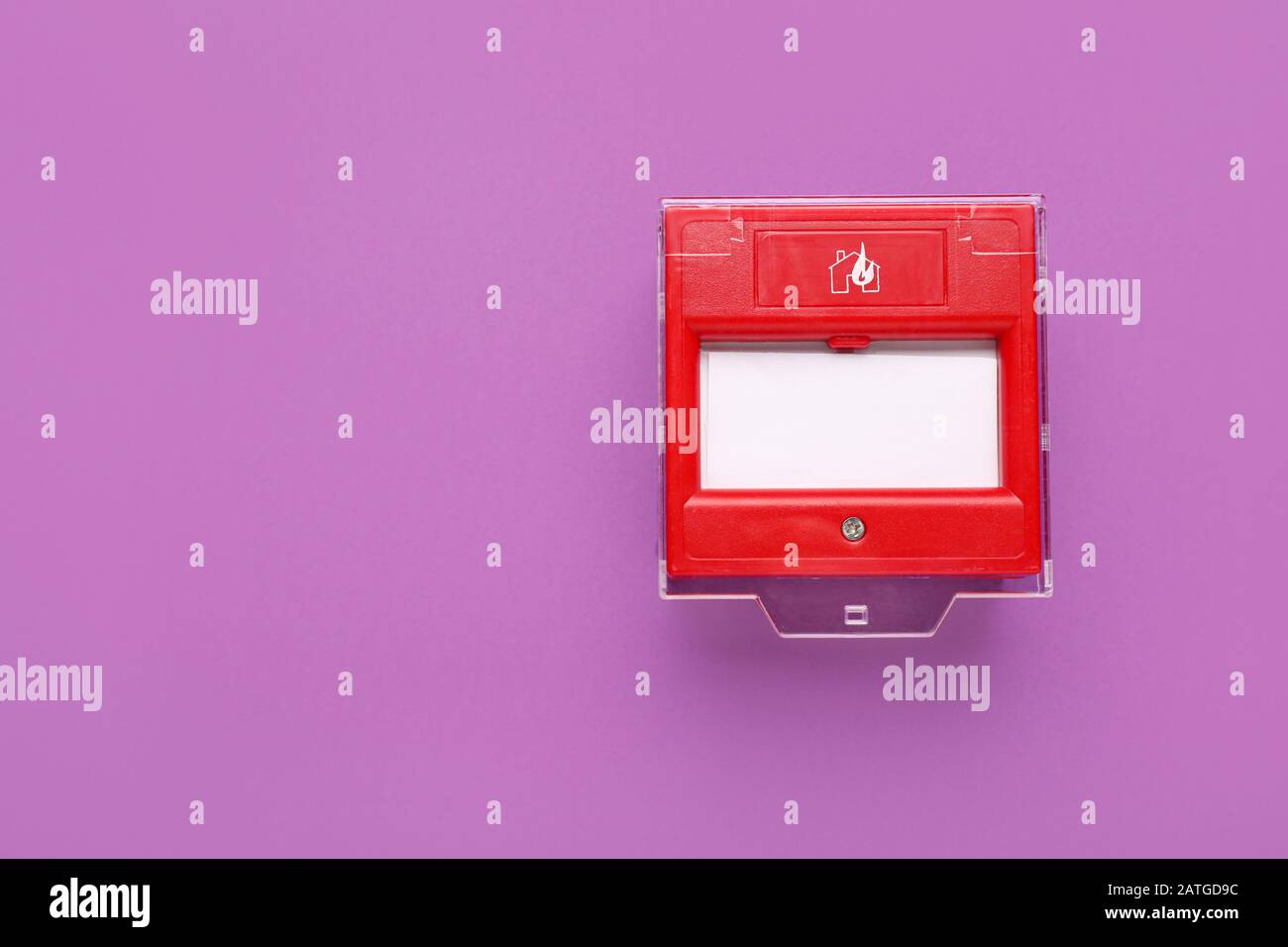 Modern manual call point on color background Stock Photo - Alamy