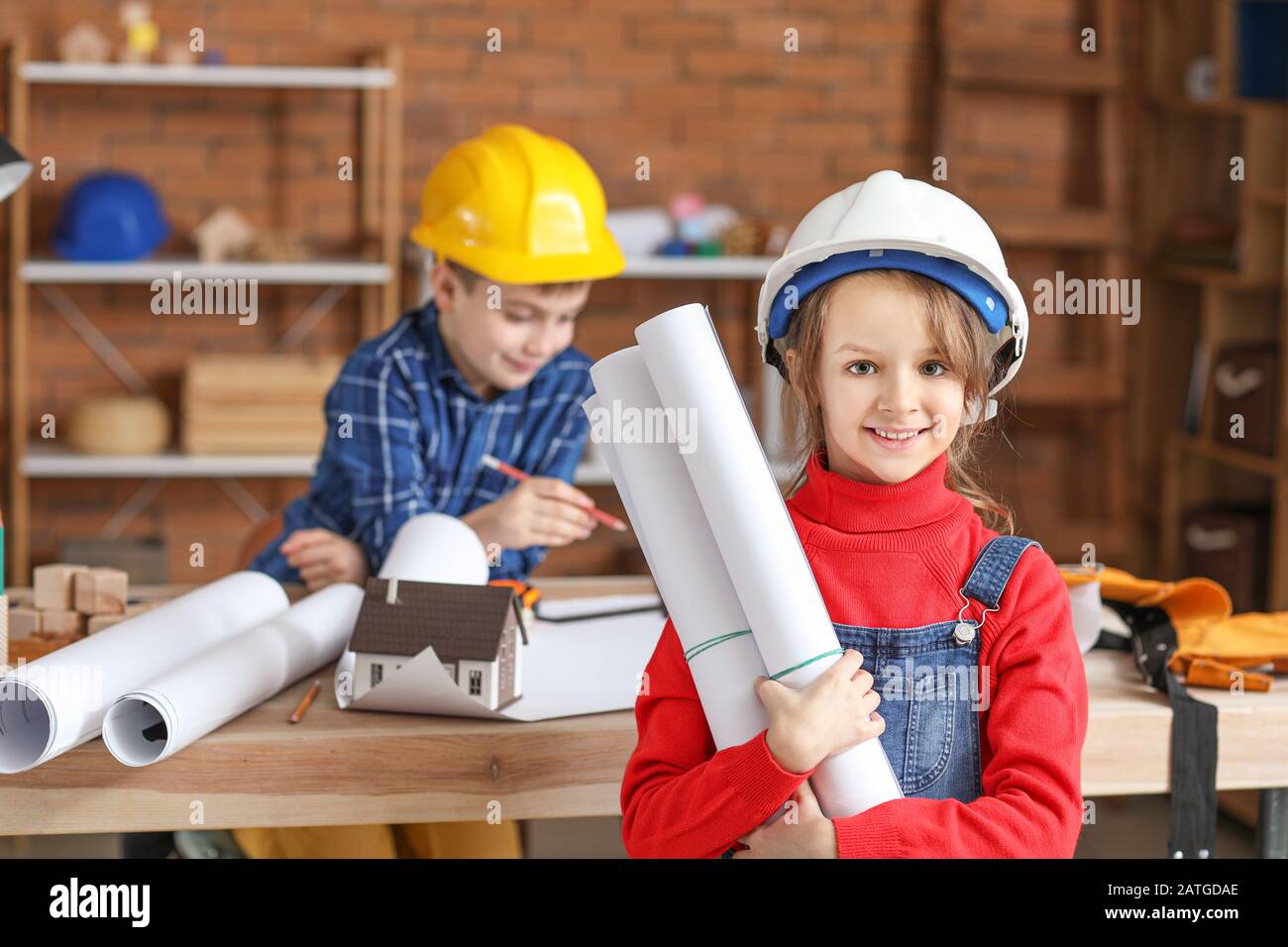 Cute little architects in office Stock Photo - Alamy