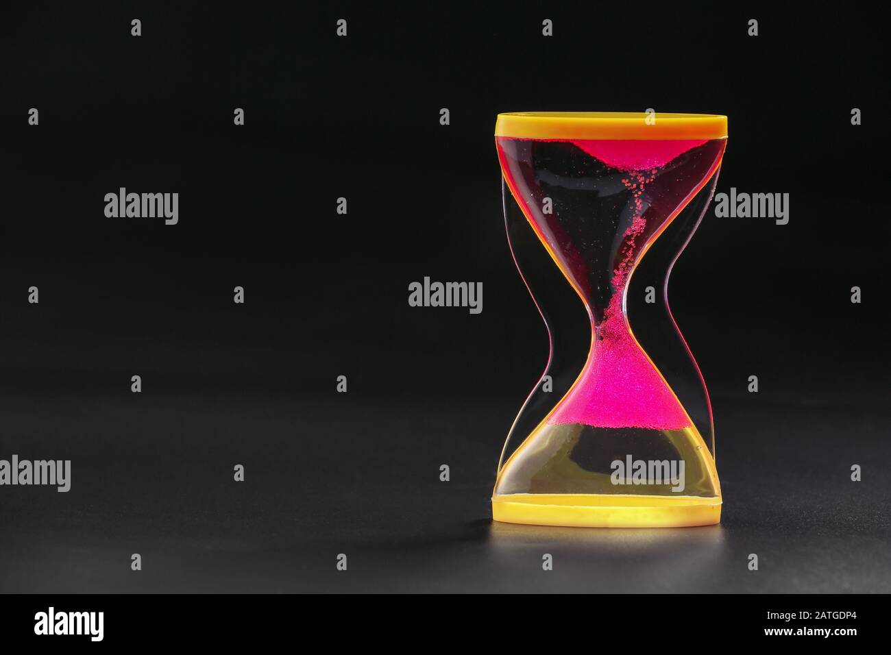 Hourglass on dark background. Time management concept Stock Photo - Alamy