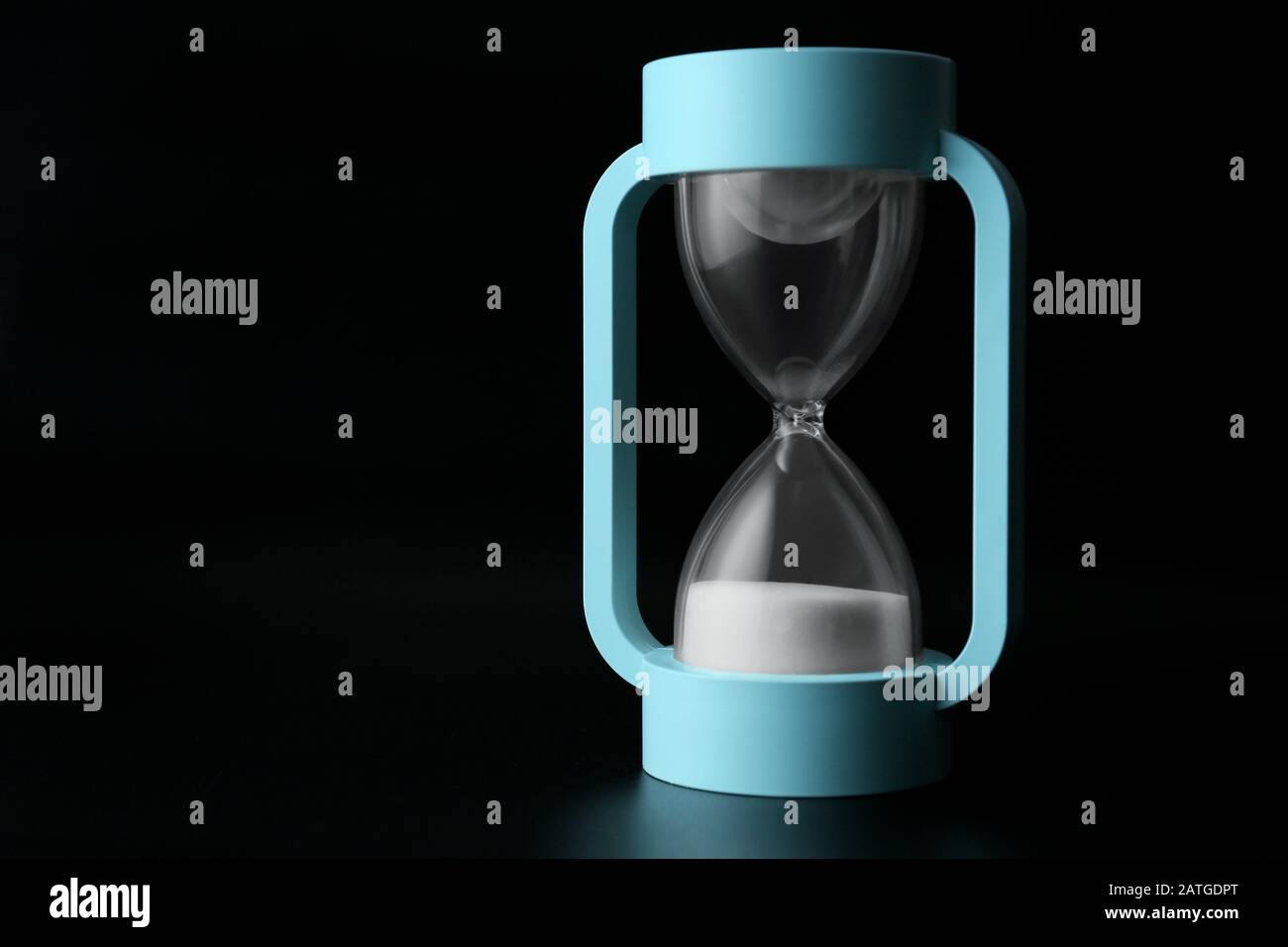Hourglass on dark background. Time management concept Stock Photo - Alamy