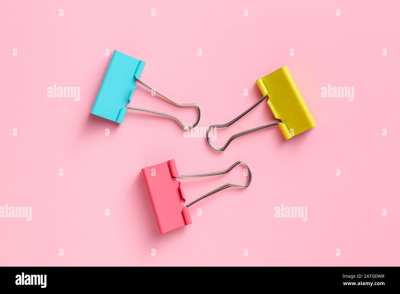 Binder clips for paper on color background Stock Photo - Alamy