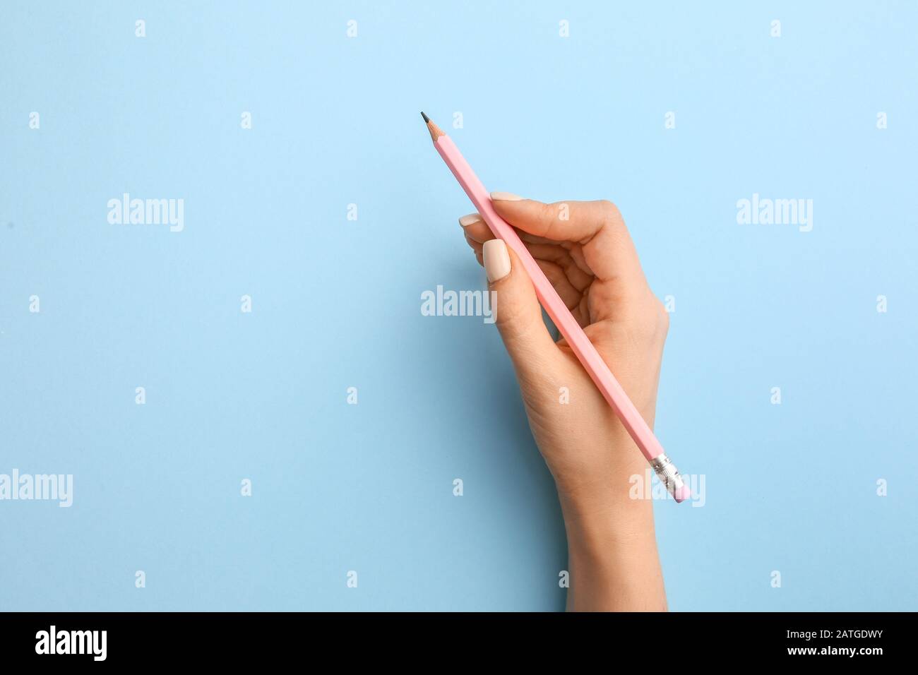 School pupil hand holding pencil hi-res stock photography and images ...