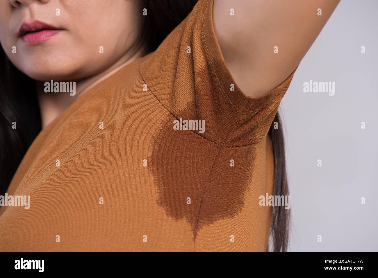Woman sweating badly under armpit hi-res stock photography and images ...