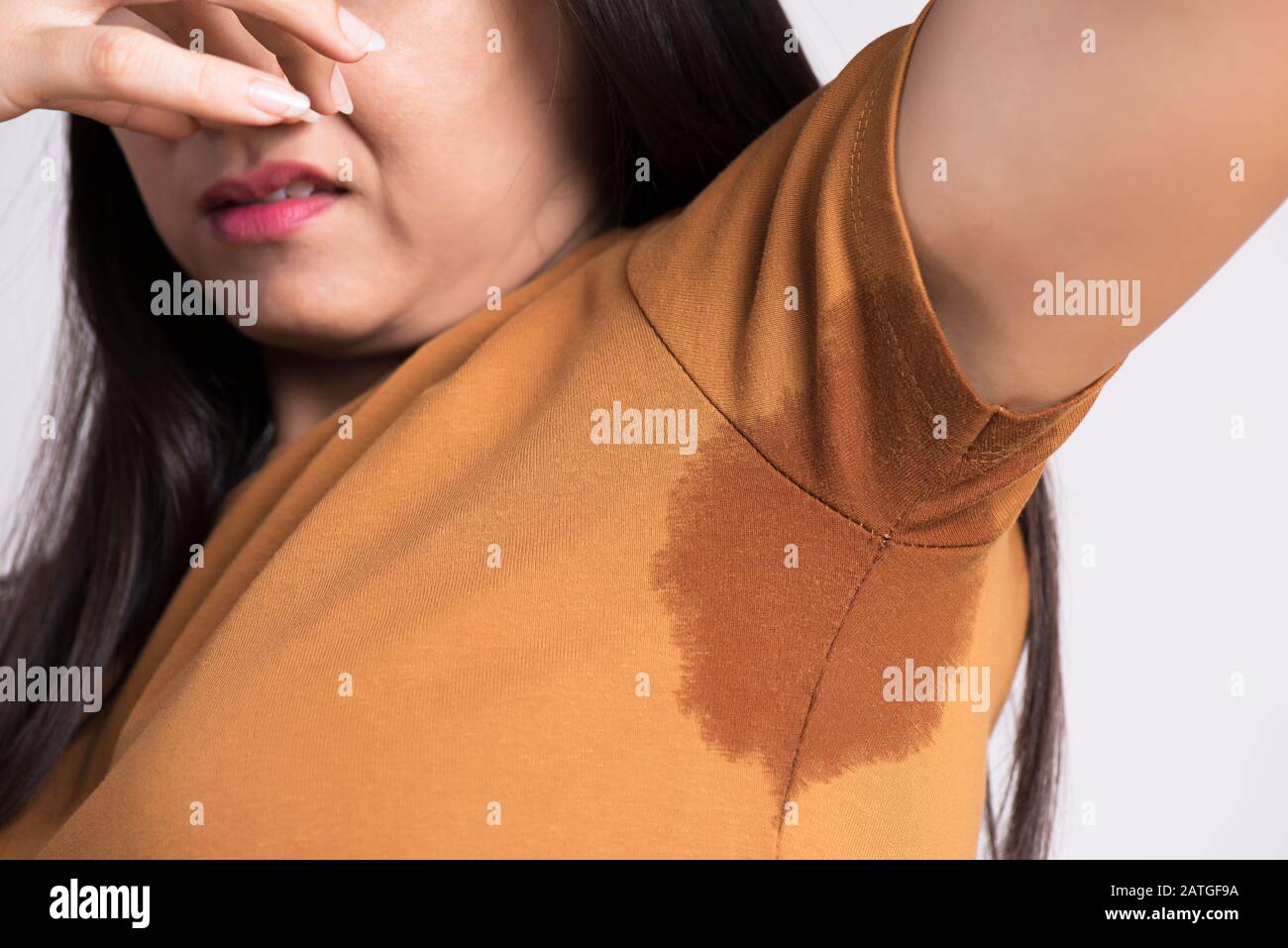 Close-up asian woman with hyperhidrosis sweating. Young asia woman with ...