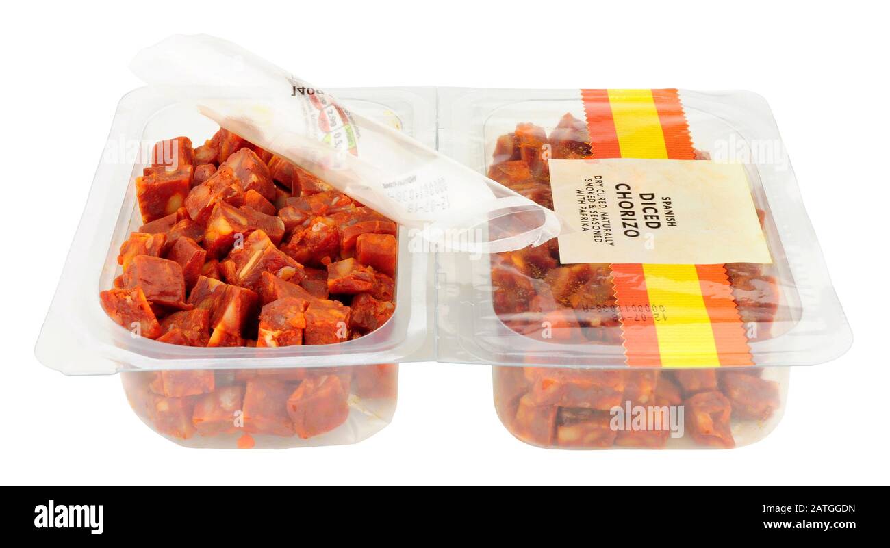 Pack of diced Spanish chorizo salami isolated on a white background ...