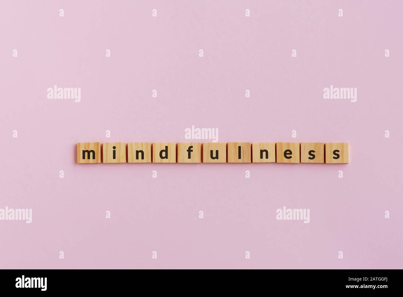 Mindfulness text wood blocks. Pink background Stock Photo - Alamy