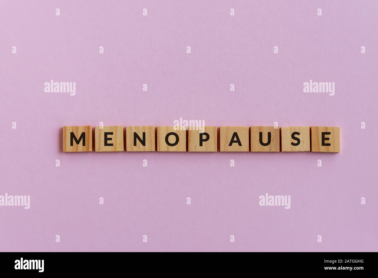 Menopause text wood blocks. Pink background Stock Photo - Alamy
