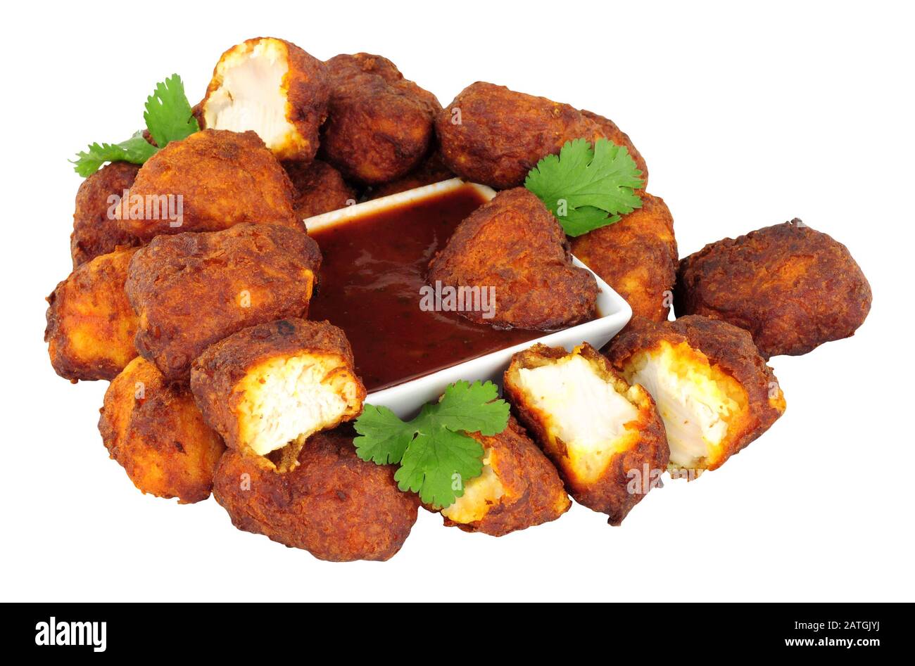 Group of fried chicken pakora with chilli sauce dip isolated on a white ...