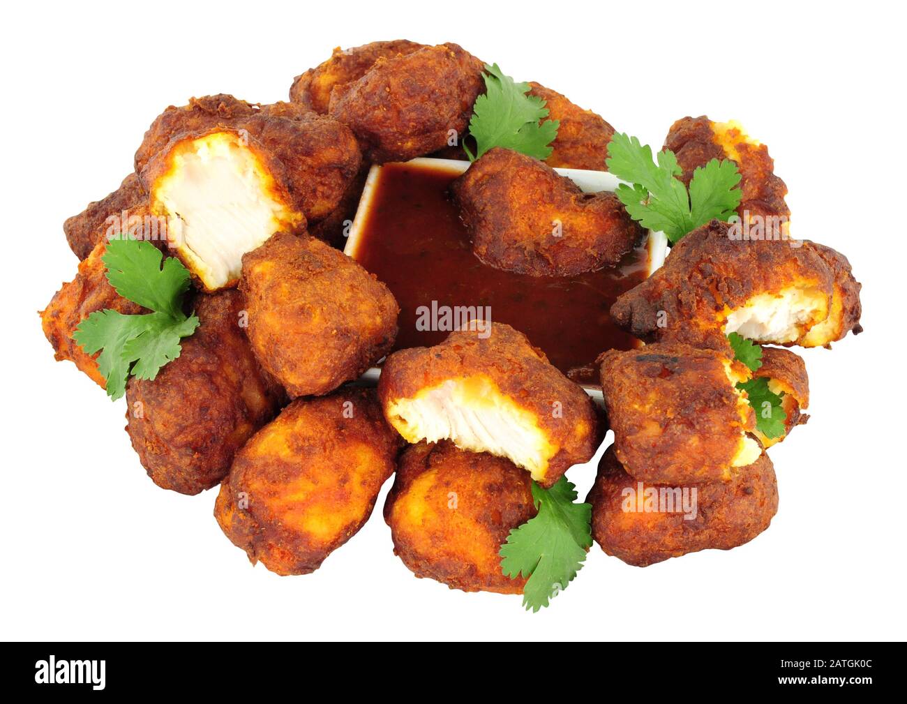 Group of fried chicken pakora with chilli sauce dip isolated on a white ...