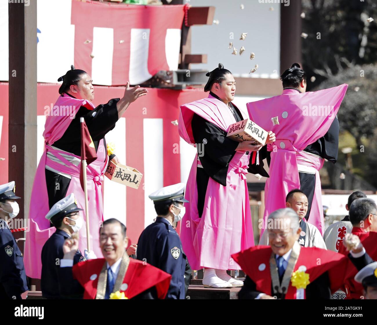 Narita, Japan. 03rd Feb, 2020. Sumo wrestlers Mitakeumi (L) and Endo (C ...