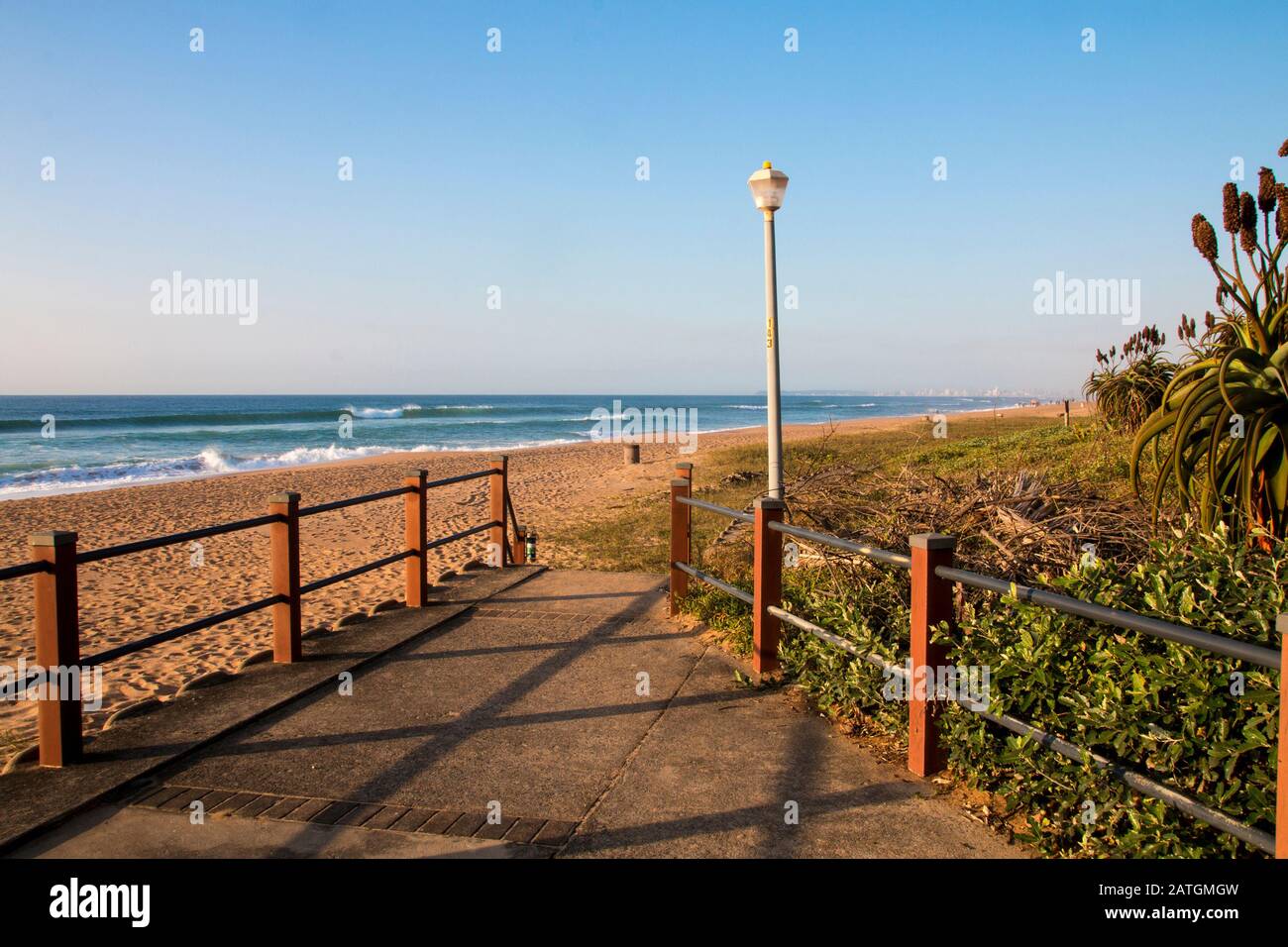 Pathway with metal railings leading onto beach Stock Photo - Alamy
