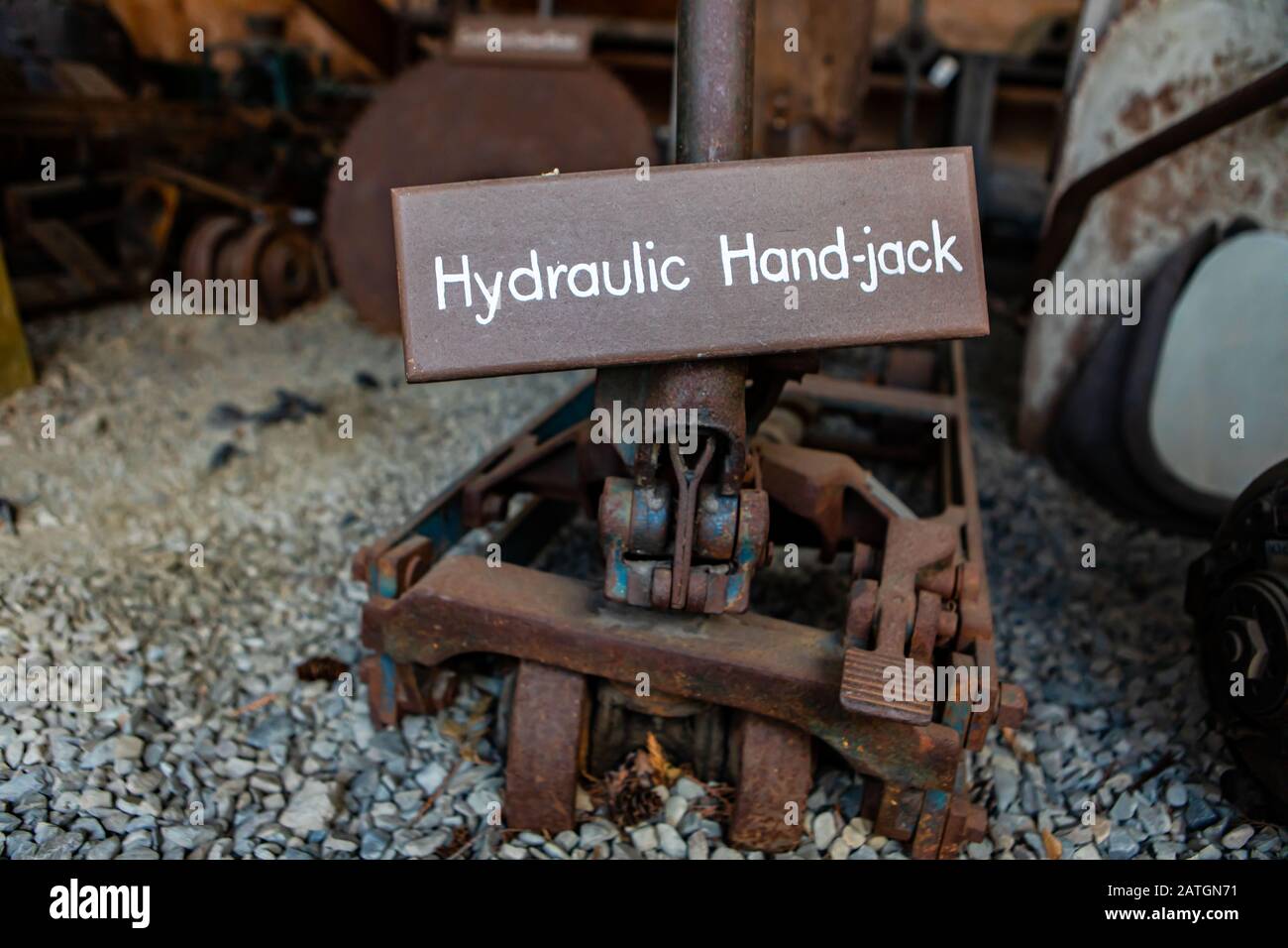 An old and rustic industrial engine in the museum. A vintage hydraulic ...