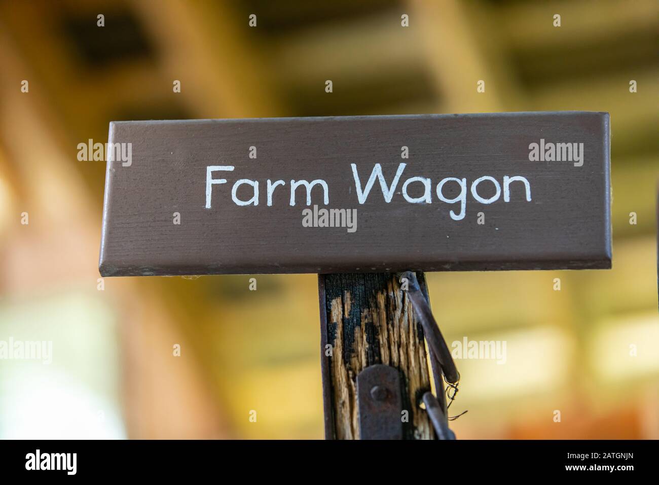 Farm wagon - sign board hanged on wood. Old vintage farm wagon in the ...