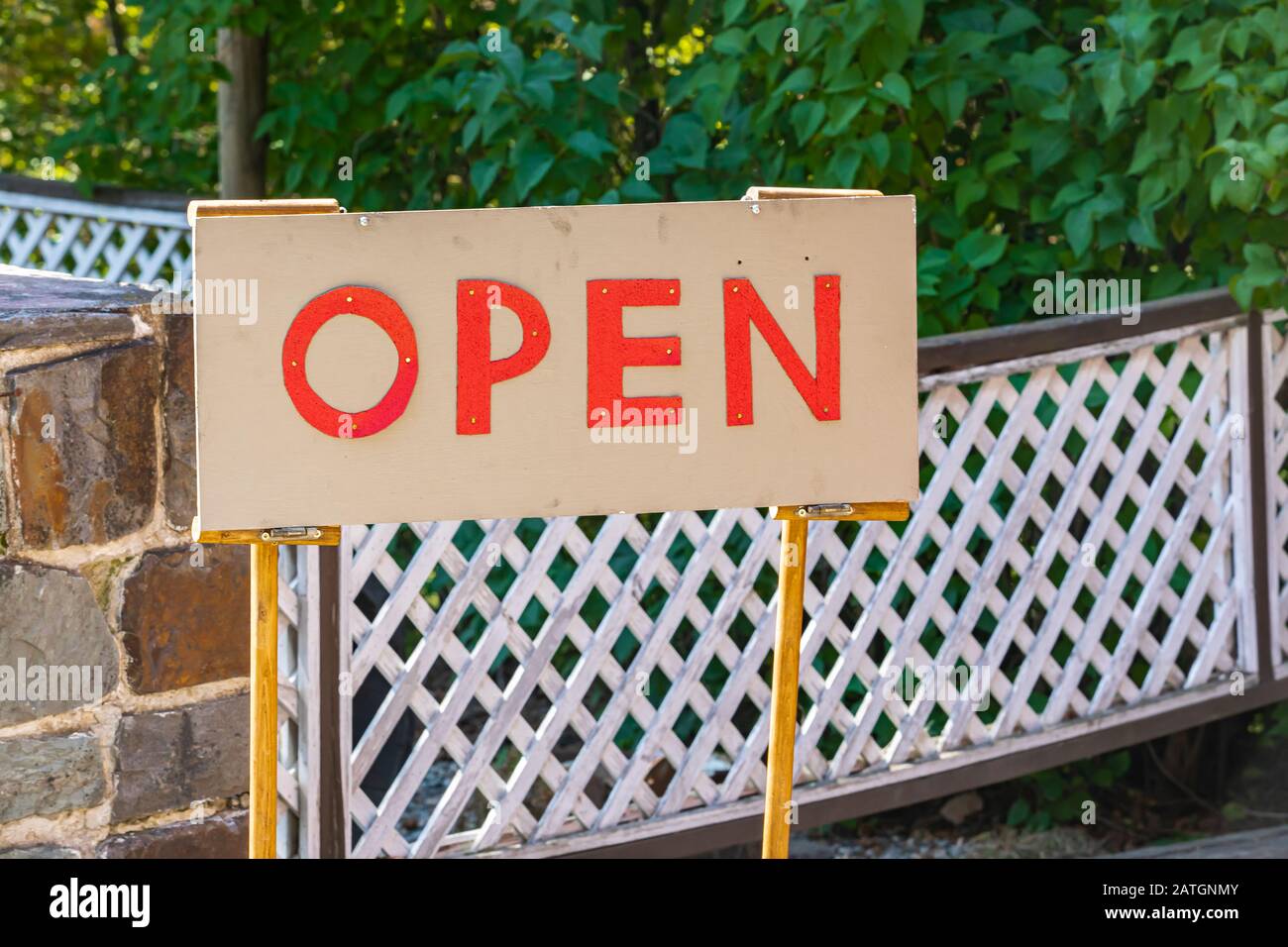 Open sign on the paper placard standing on the entrance to a museum ...