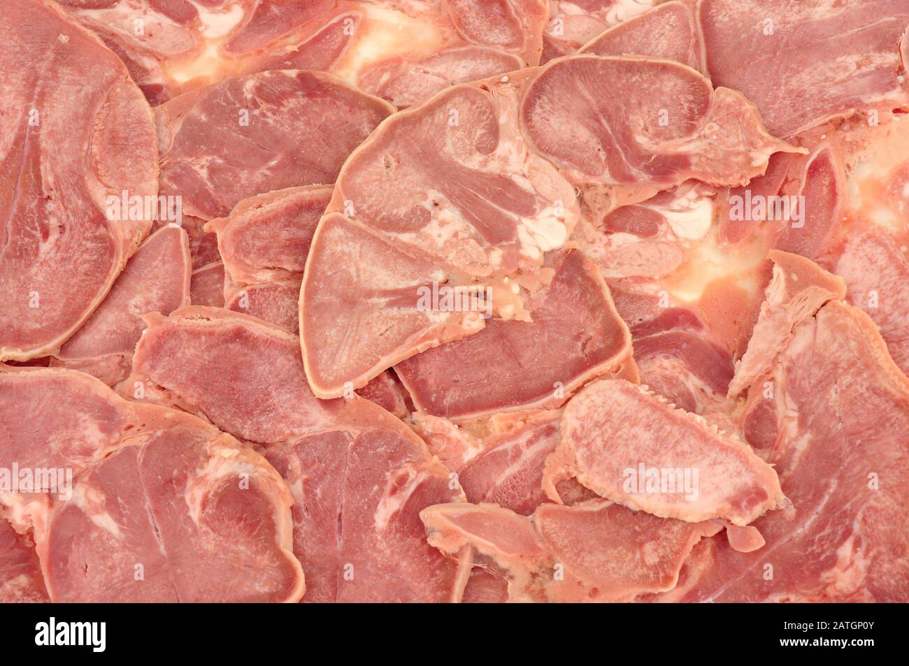 Cooked sliced pork tongue luncheon meat background Stock Photo - Alamy