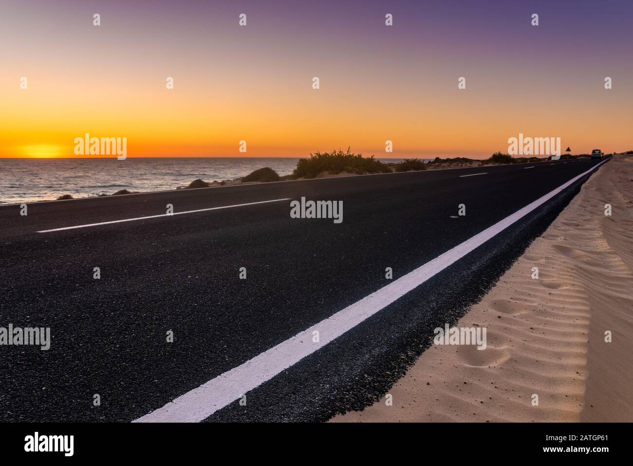 Asphalt road running across hi-res stock photography and images - Alamy