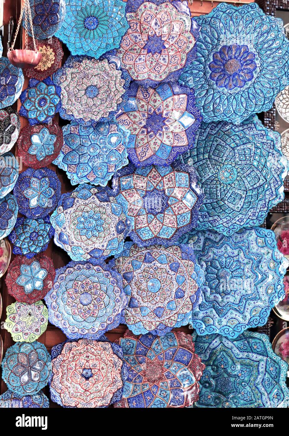 Traditional Iranian souvenirs - copper plates and dishes with floral ...