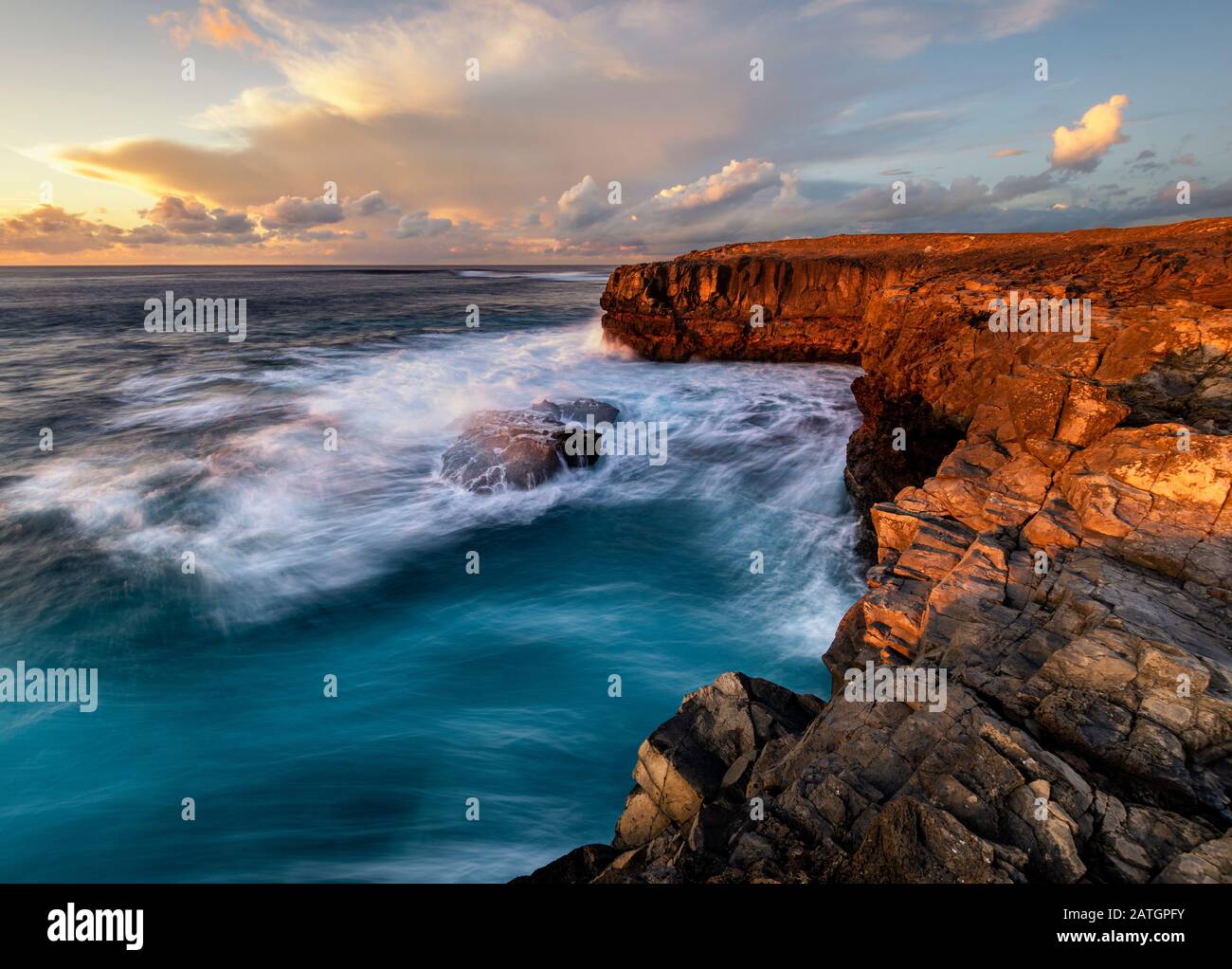 beautiful and dramatic sunset on a craggy rocky cliff, Jandia Peninsula ...